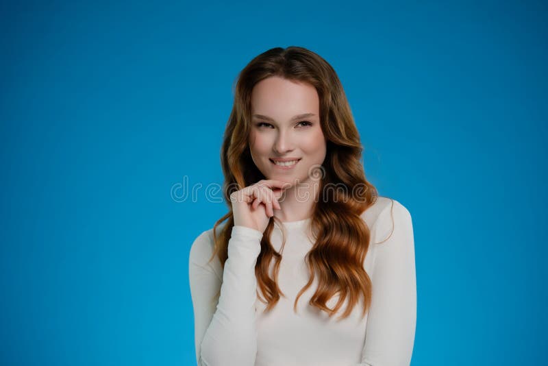 Woman Posing Playful Expression Against Bright Blue Background Studio ...
