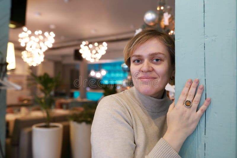 Woman posing in restaurant stock image. Image of posing - 203788353