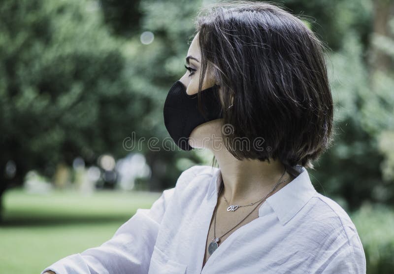 Woman Posing and Wearing a Black Protective Mask Stock Photo - Image of ...