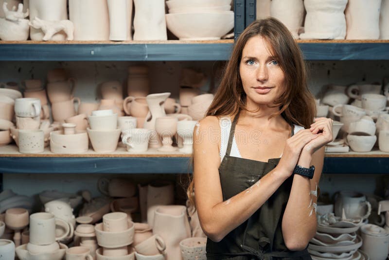 Woman Potter Posing in Her Ceramic Studio with Assortment of Clay Products Stock Image - Image ...