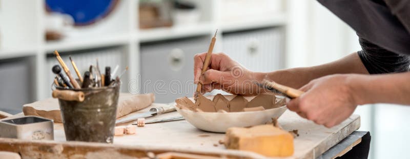 Woman Using Carving Tool on Plate Stock Photo - Image of equipment ...