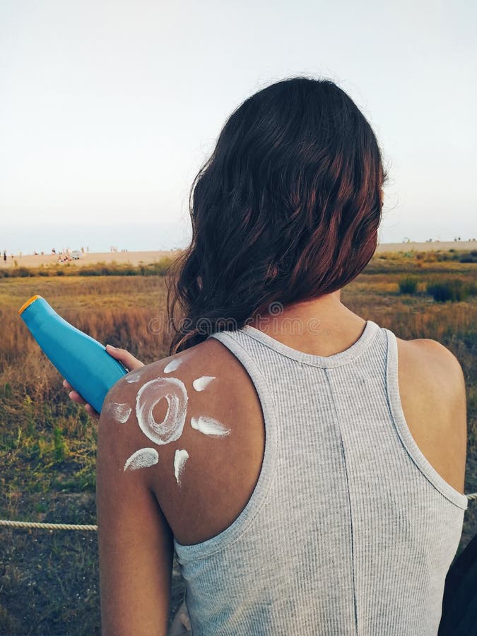 Woman pouring sun cream. stock photo. Image of beauty - 152068224