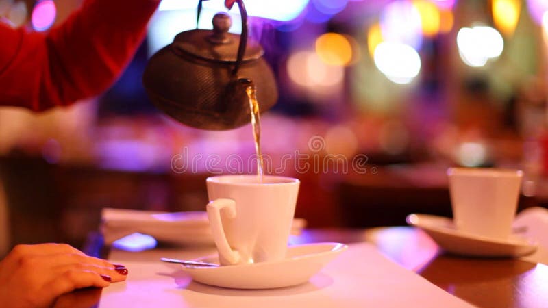 Woman Pouring Tea from Teapot into Stock Footage - Video of health ...