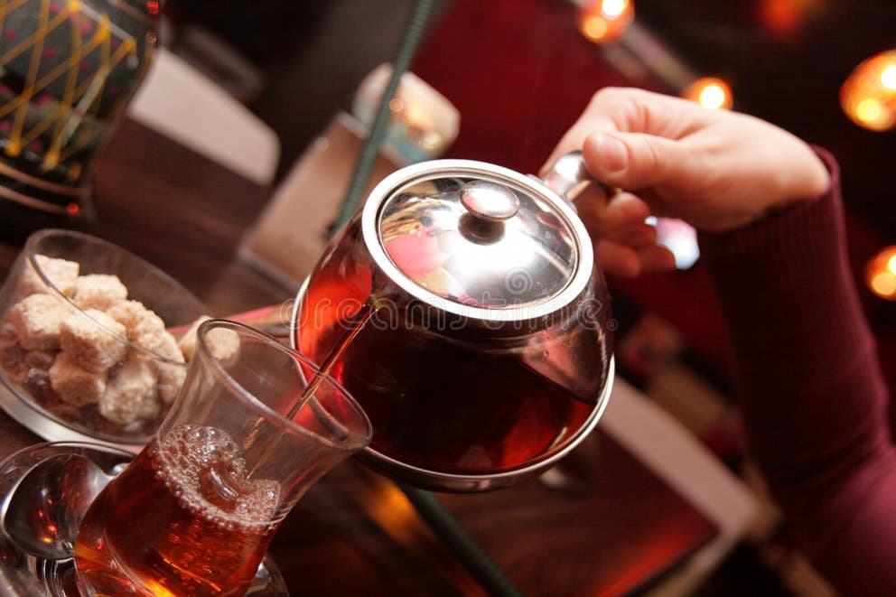 Woman pours tea stock photo. Image of hold, pouring, cafe - 20723528