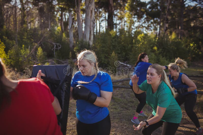 Woman Practicing Boxing in the Boot Camp Stock Photo - Image of boxer ...