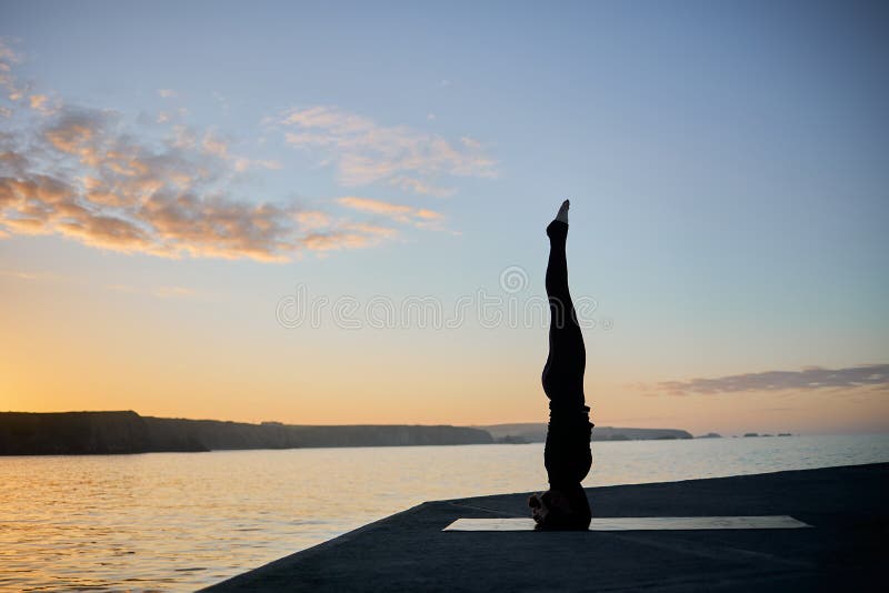 Woman Practicing a Difficult Yoga Pose during Sunset Time Stock Image ...