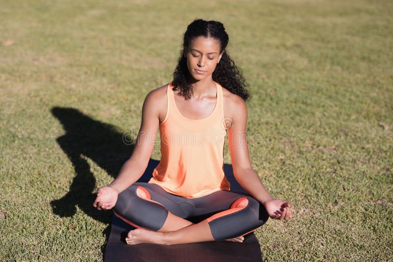 Woman Practicing Lotus Position on Mat Stock Photo - Image of healthy ...