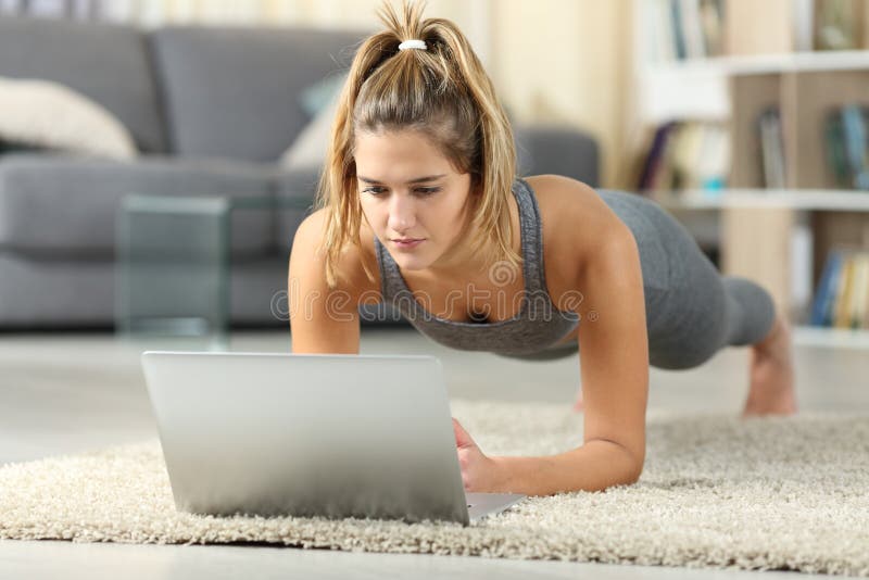 Woman Practicing Sport Watching Video Tutorials Stock Photo - Image of ...