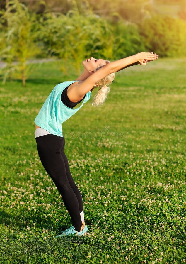 Woman Practicing Standing Backbend Pose Stock Photo - Image of ...