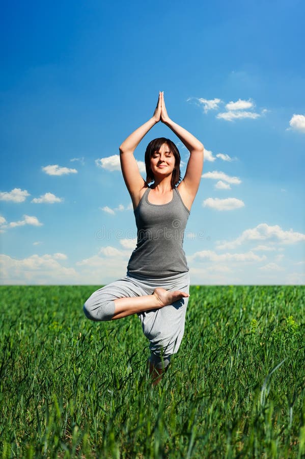 Woman Practicing Yoga at the Field Stock Photo - Image of meadow, field ...