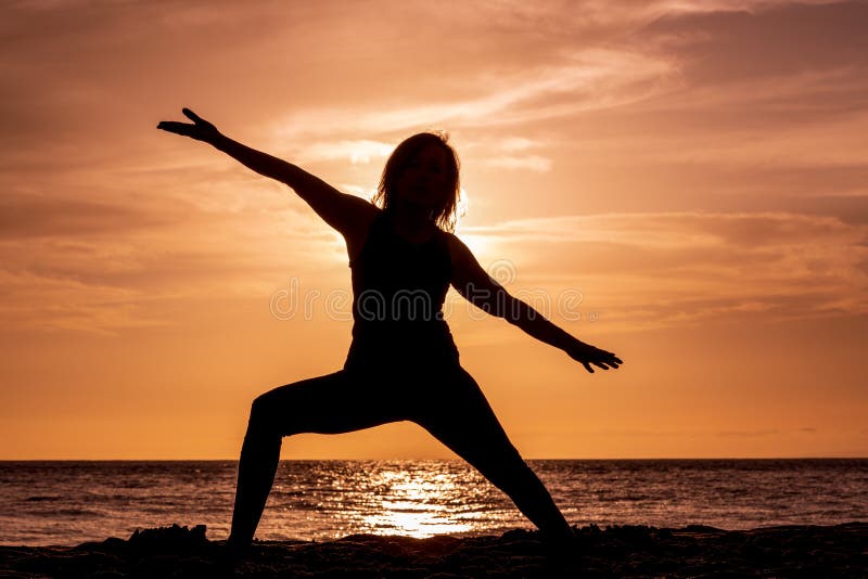 Woman Practicing Yoga on Maui at Sunset Stock Photo - Image of pose ...