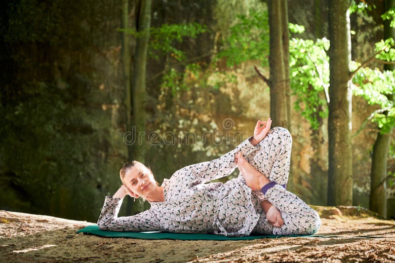 Woman Practicing Yoga Outdoors In Forest Barefoot Female On Yoga Mat
