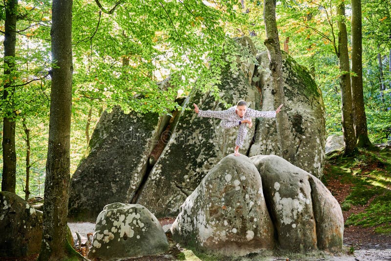 Woman Practicing Yoga Outdoors In Forest Barefoot Female On Yoga Mat