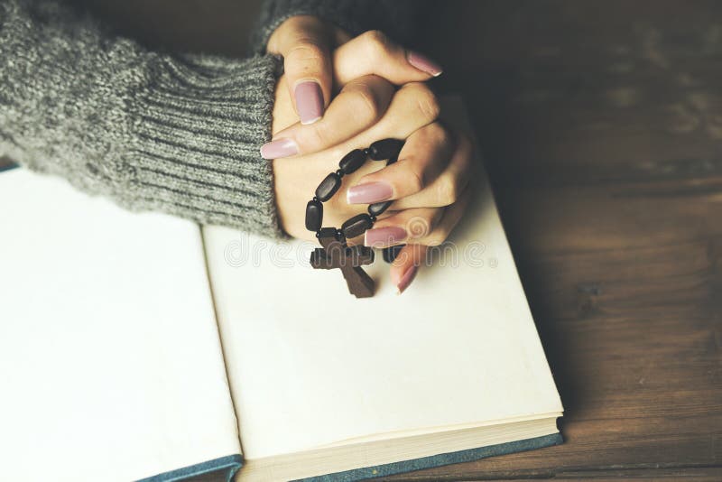 Woman hand cross on book stock image. Image of shot - 158213765