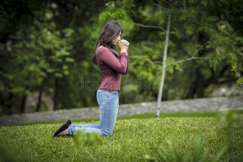 Woman praying outdoors stock image. Image of light, believe - 86981235