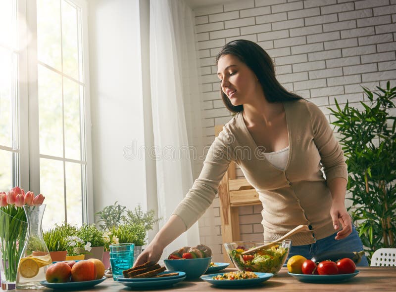 Woman prepares the dinner stock photo. Image of event - 66725826