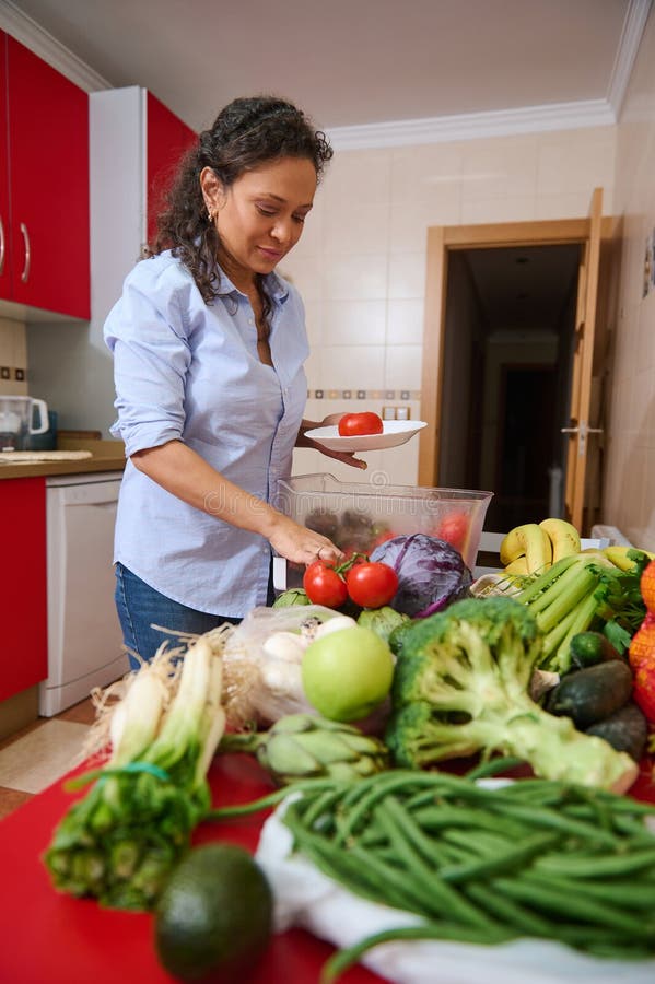 Woman Preparing Fresh Vegetables in a Modern Kitchen Setting Stock ...