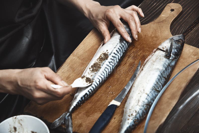 Woman Preparing Mackerel Fish Stock Image - Image of lifestyle, body ...