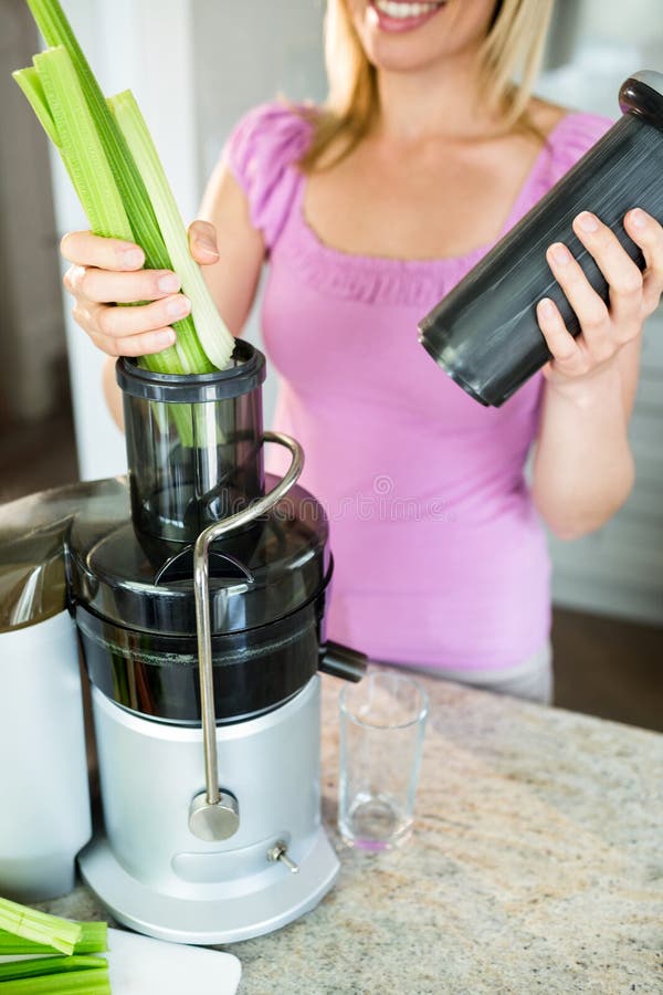 Woman Preparing a Smoothie in the Kitchen Stock Image - Image of homey ...