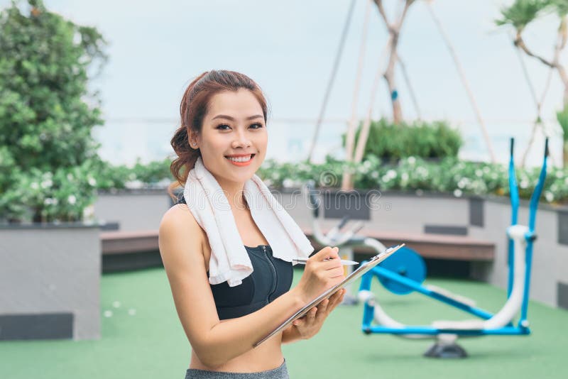 Woman Preparing Workout Plan for Training. Stock Image - Image of ...