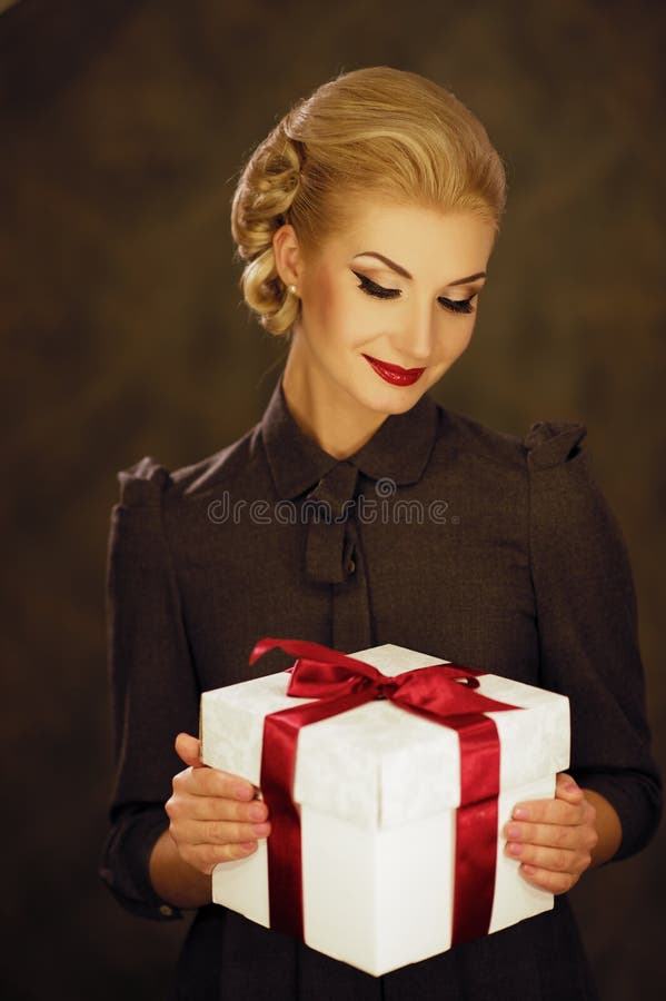 Woman with a present stock photo. Image of closeup, looking - 28681802