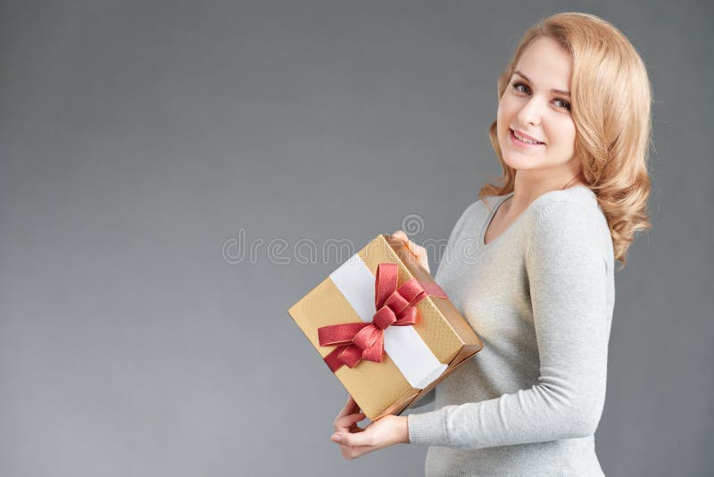 Woman with present stock image. Image of isolated, birthday - 95601105