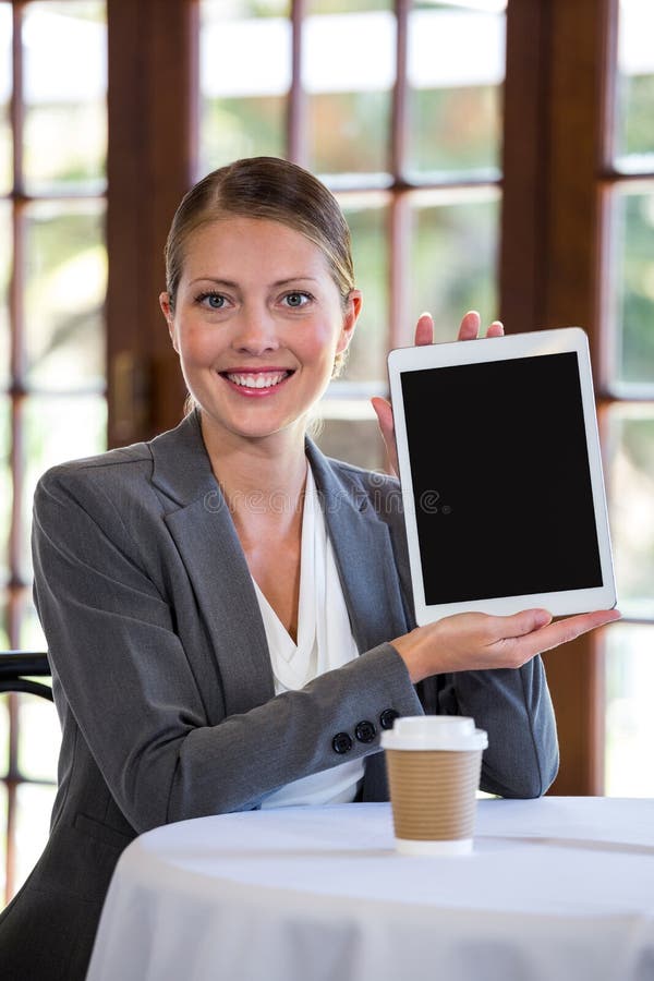 Woman presenting a tablet stock photo. Image of retail - 73245212