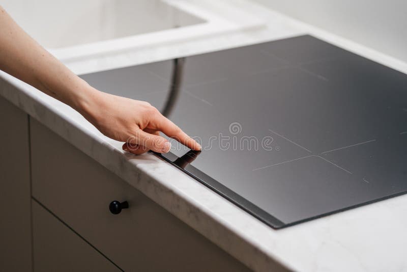 Woman Press Button on Control Panel at Modern Induction Stove Stock ...