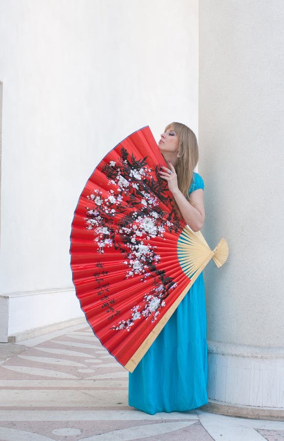 The Woman Presses To Itself the Big Fan Stock Photo - Image of blonde ...