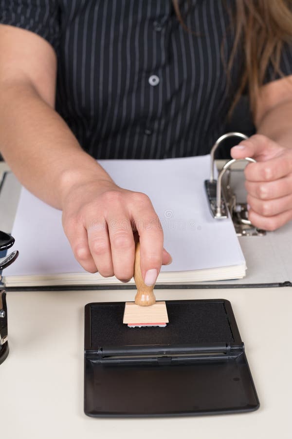 Woman is Pressing a Stamp at Stamp Pad Stock Photo - Image of white ...