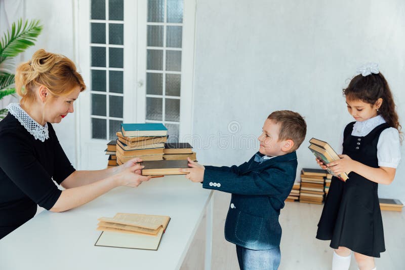Woman Primary School Teacher in Classroom in Class with Kids Stock ...