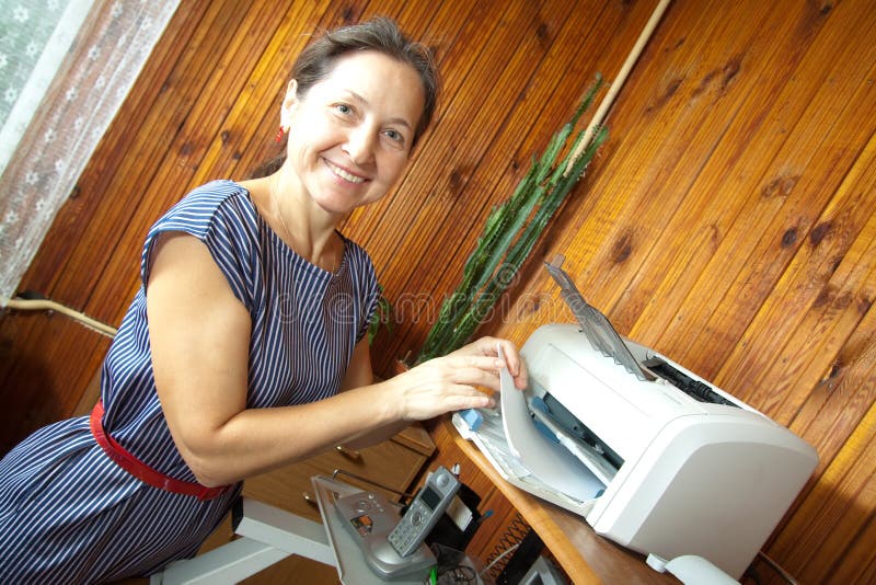 Woman Printing on the Printer Stock Photo - Image of casual, happiness ...