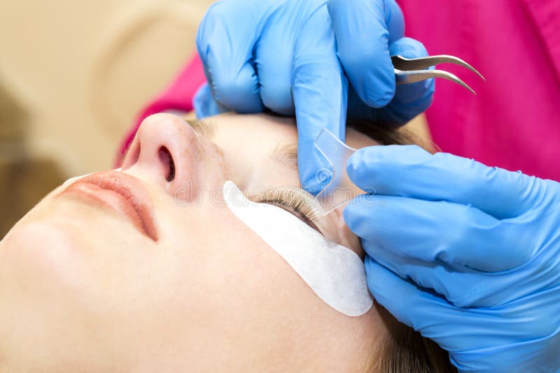 Woman on the Procedure for Eyelash Extensions Stock Photo - Image of ...