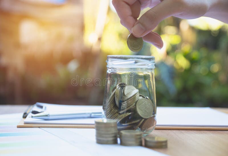 Woman Process and Drop Coin into the Glass with Stack Coins and Stock ...