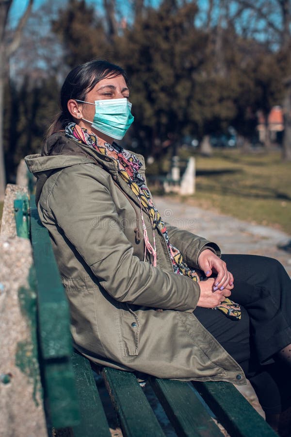 Woman with Protective Face Social Distancing on Empty Park Bench Stock ...