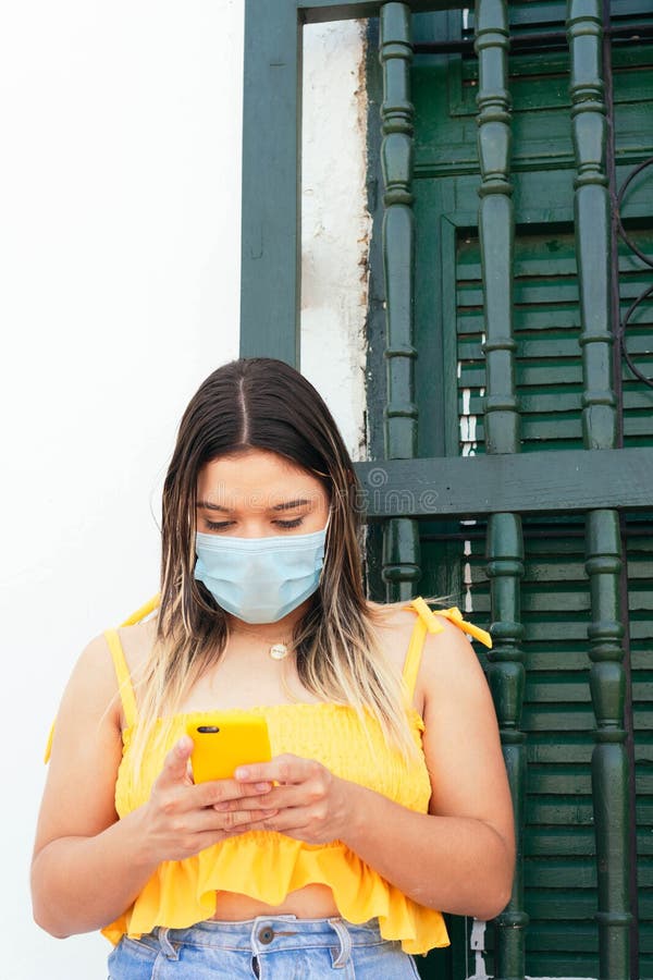 Woman with Protective Mask Using Cell Phone in the Open Air Stock Image ...