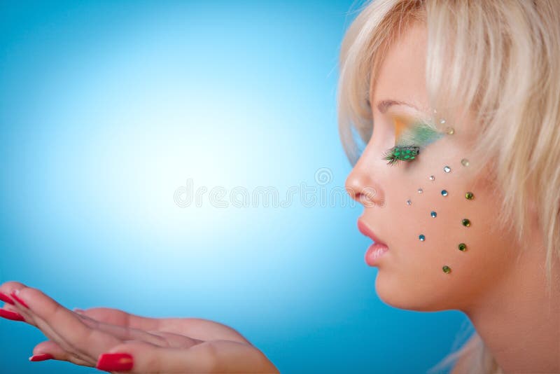 Woman Puffing at Something Situated on Hand Stock Photo - Image of ...