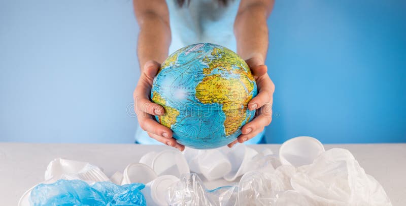 Hand is Pulling the Earth in the Form of a Globe Out of the Oil ...