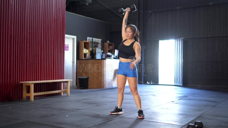 Woman Pulling Weights with Lat Machine on a Gym Stock Footage - Video ...