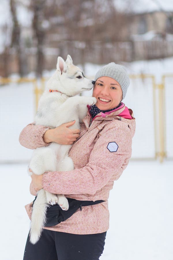 Woman with Puppy Siberian Husky Stock Photo - Image of fashion, person ...