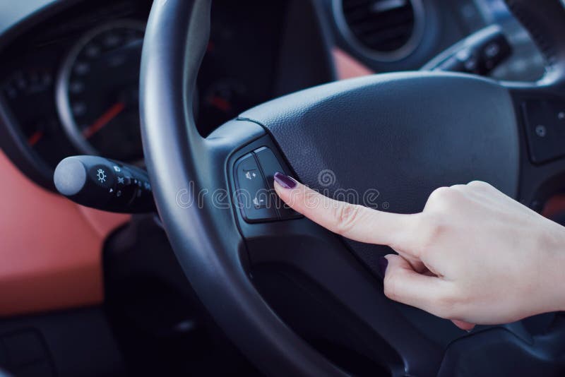 Woman Push the Button on a Steering Wheel in Car Stock Image - Image of ...