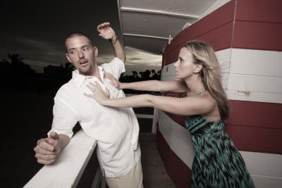 Woman Pushing the Man Over the Edge Stock Photo - Image of couple, edge ...