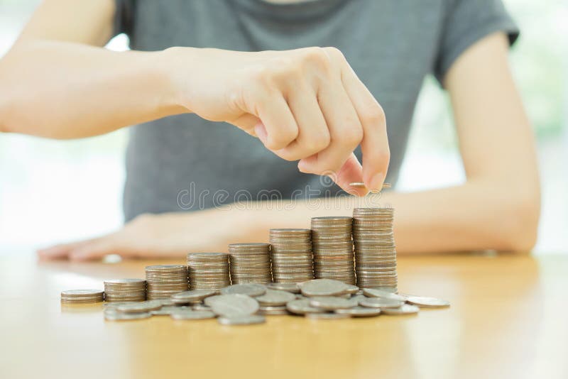 Woman Put Coins To Stack of Coins Stock Photo - Image of asian, finance ...