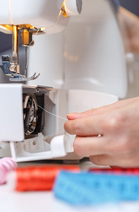 Woman Put Thread in Sewing-machine Stock Photo - Image of clothes ...