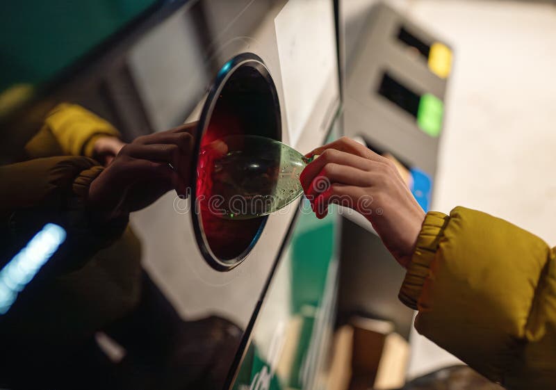 Woman Puts Bottle in Automatic Bottle Recycling Machine. Stock Photo ...