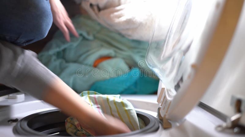 Woman Puts Laundry in the Washing Machine. View from Above Stock Video ...