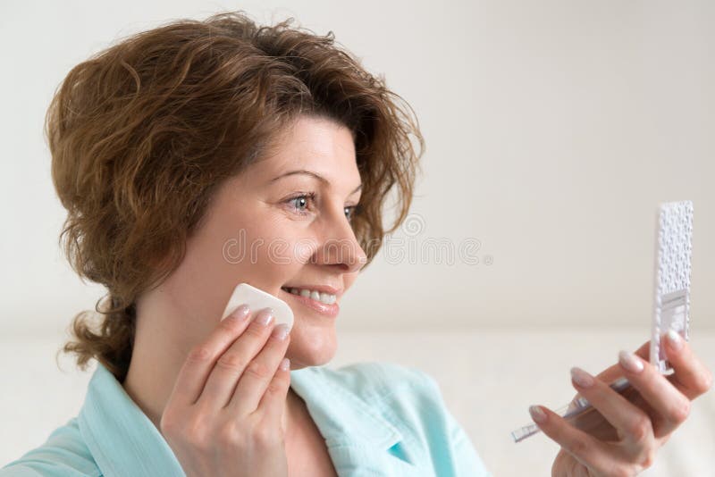 Woman Puts Makeup on Face of Yourself Stock Photo - Image of attractive ...