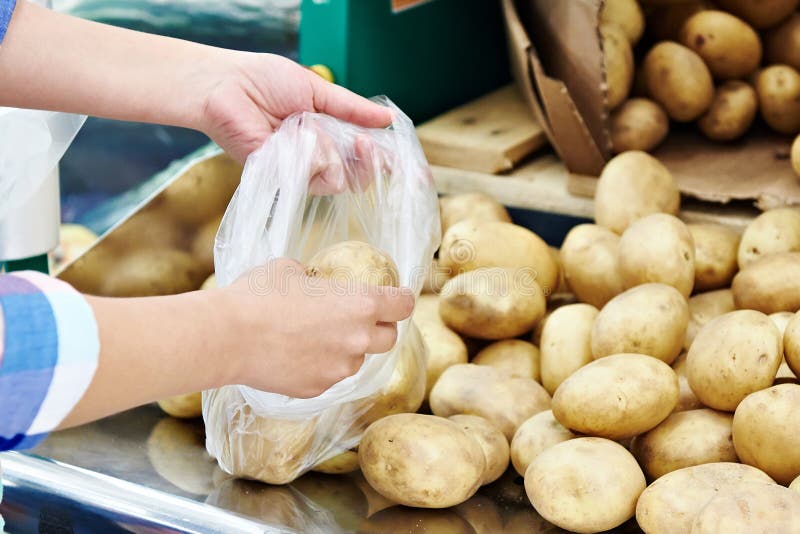 Woman Puts Potatoes Package Stock Photos - Free & Royalty-Free Stock ...