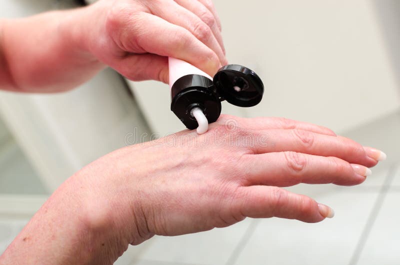 Woman Putting Cream on Her Hand Stock Image - Image of health, care ...
