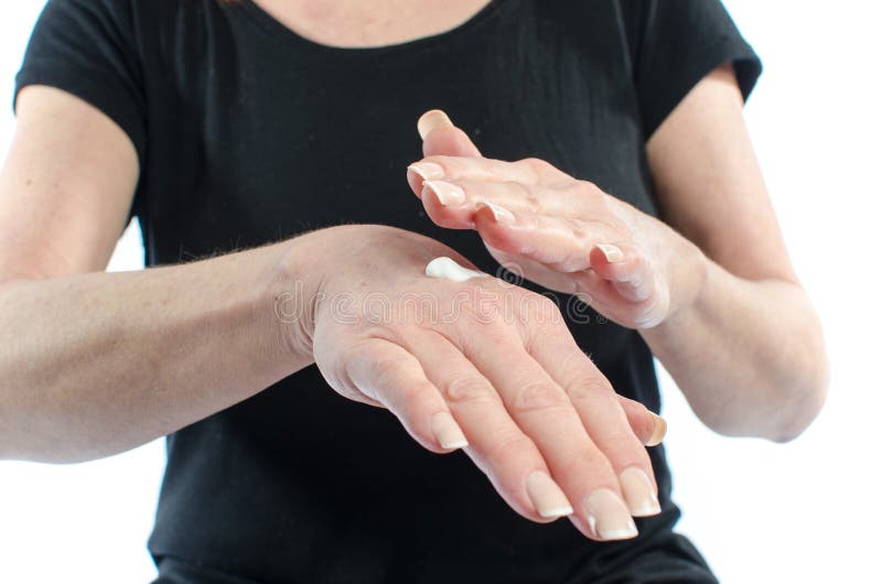 Woman Putting Cream on Her Hand Stock Photo - Image of creme, female ...